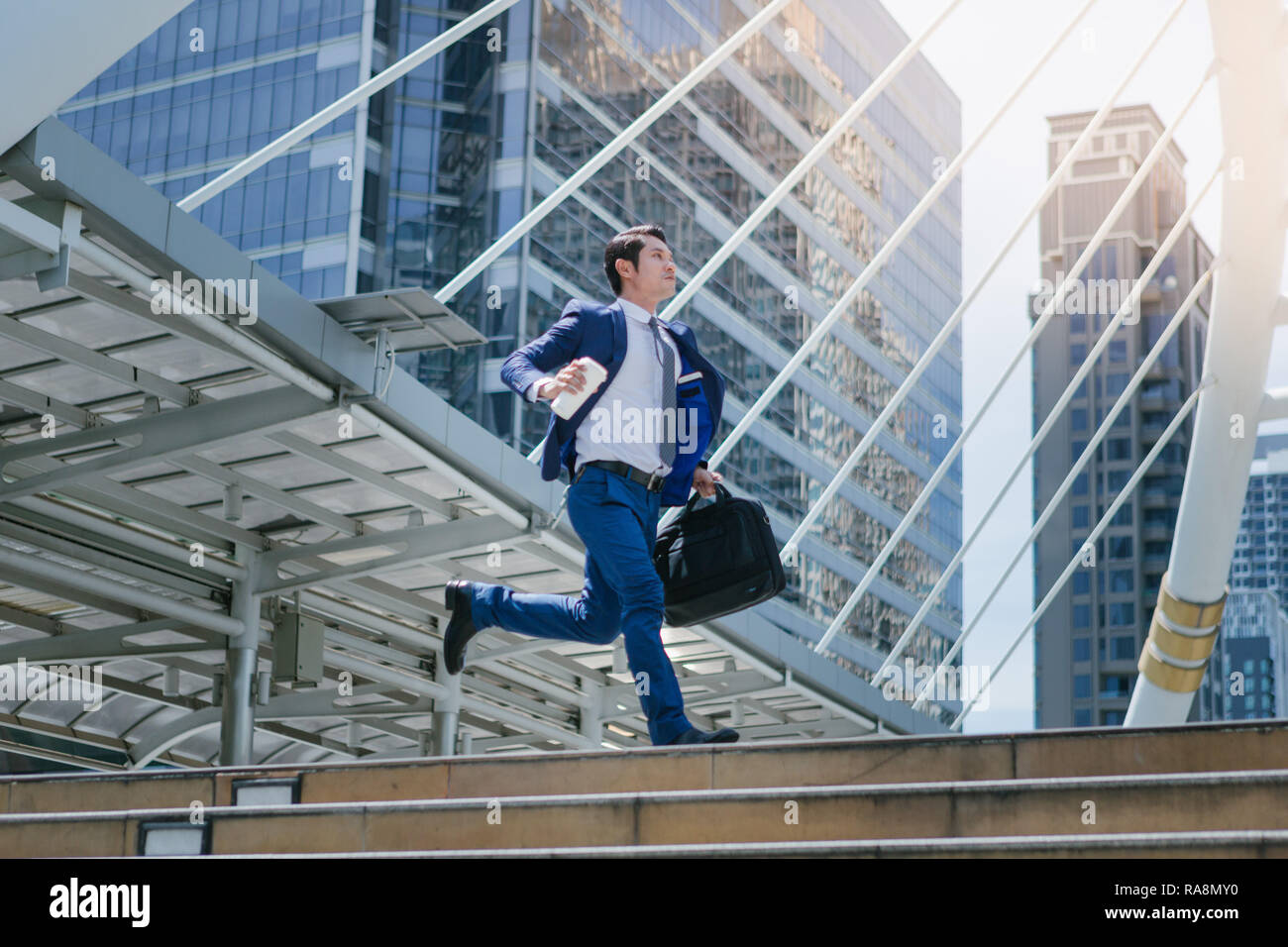 Business man run to work in rush hour Stock Photo - Alamy