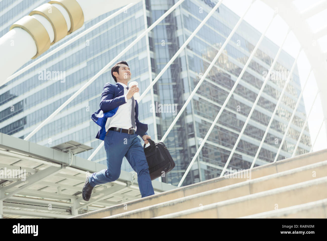 Business man run to work in rush hour Stock Photo - Alamy