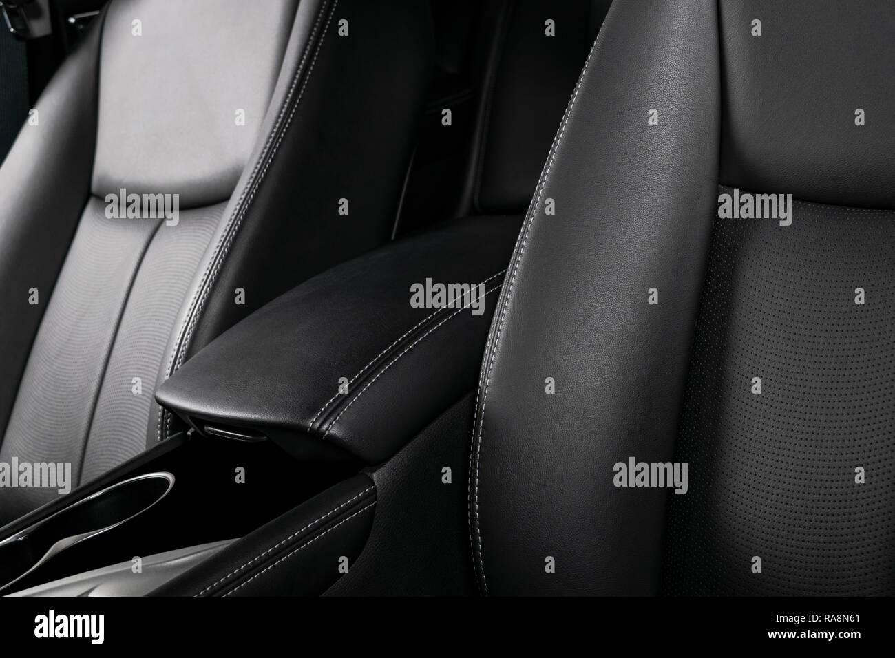 Modern luxury car black leather interior. Part of leather car seat ...