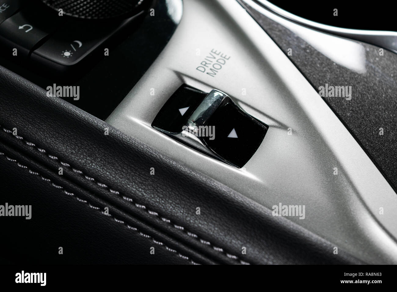 Track control buttons near automatic gear stick of a modern car in ...
