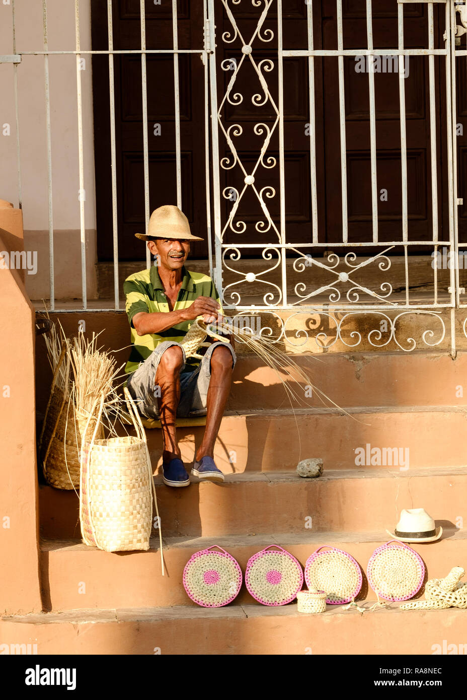 Street vendor making wicker goods in Trinidad Stock Photo - Alamy