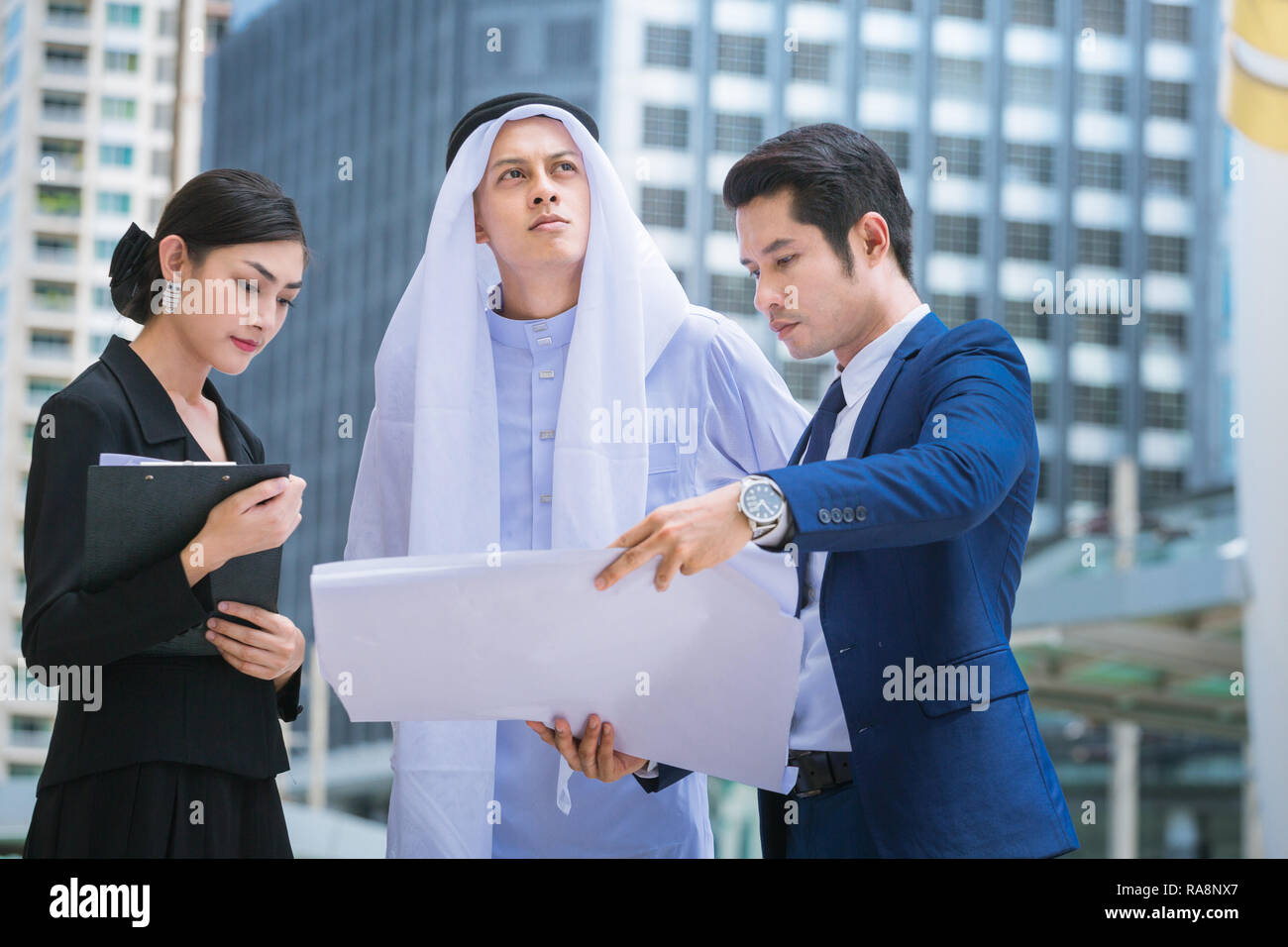 business deal between asian and Arabs peoples working outdoor Stock ...