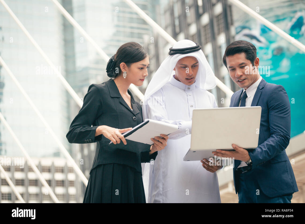 business deal between Asian and Arabs peoples working outdoor Stock ...