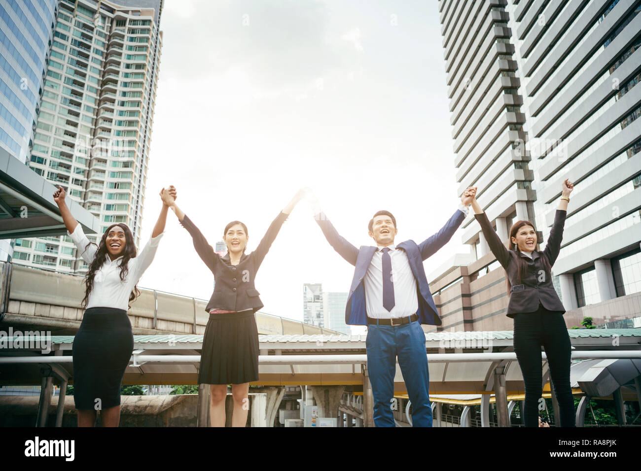 Business officers happy after success of teamwork Stock Photo - Alamy