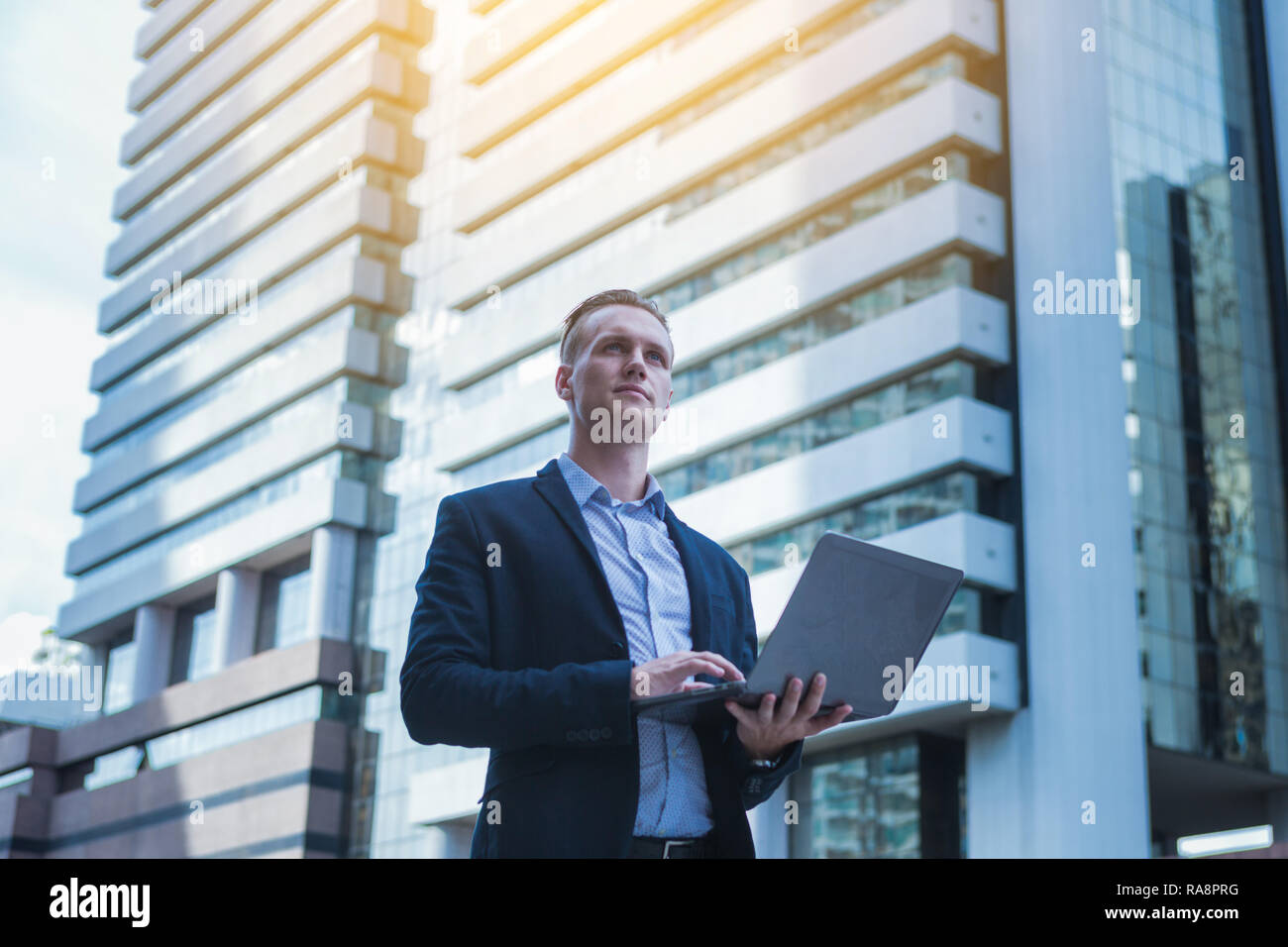 smart business man use laptop outdoor Stock Photo - Alamy