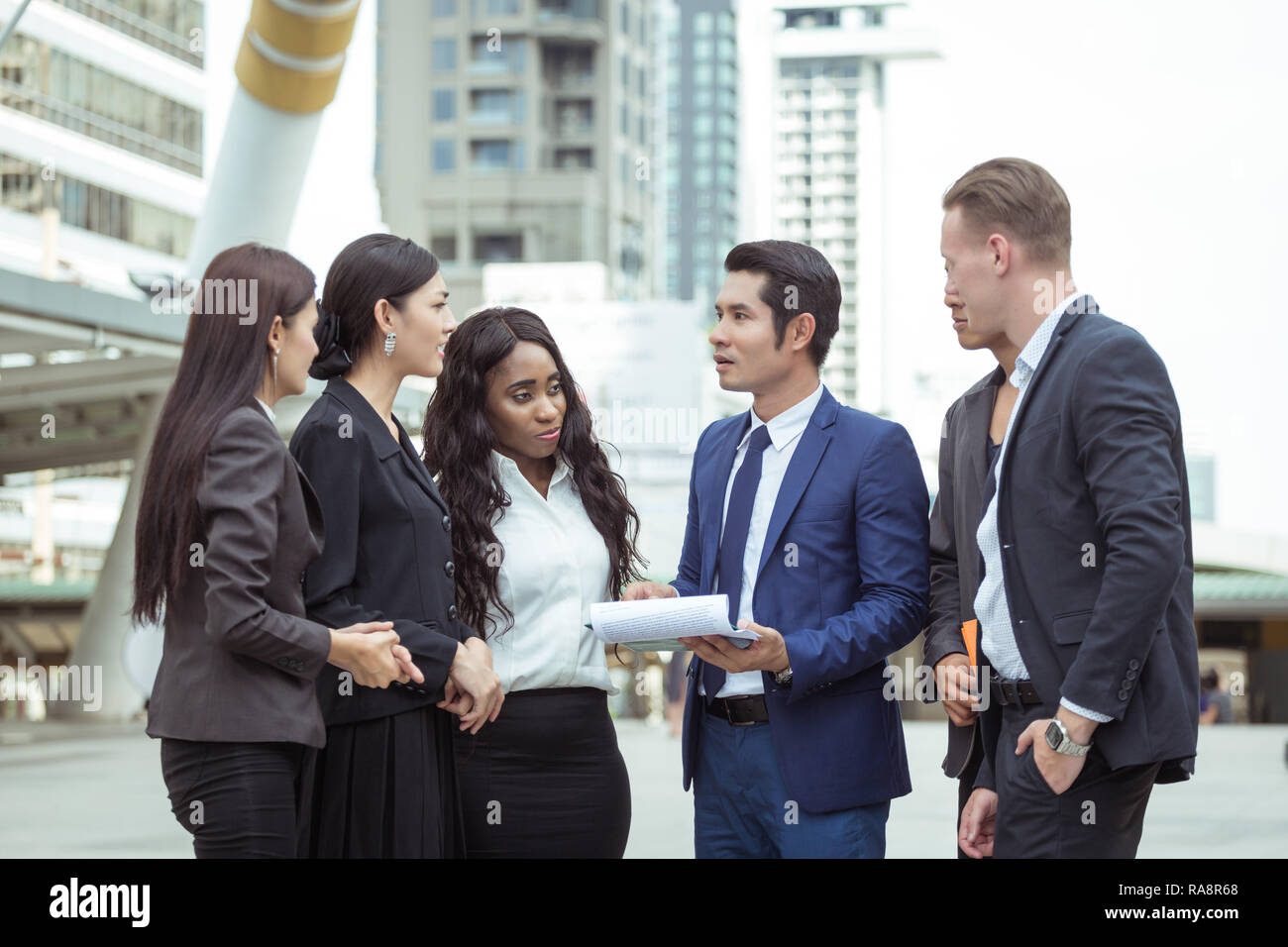 Group of officer talking business outdoor Stock Photo - Alamy