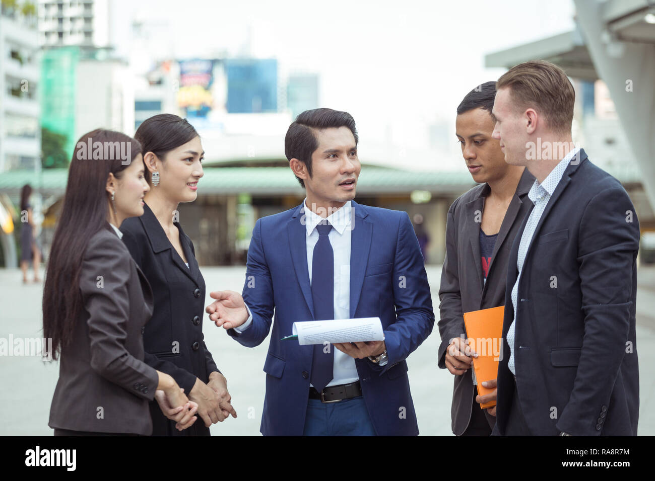 Group of officer talking business outdoor Stock Photo - Alamy