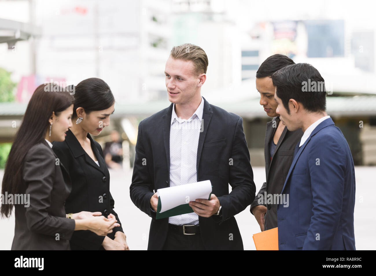 Group of officer talking business outdoor Stock Photo - Alamy