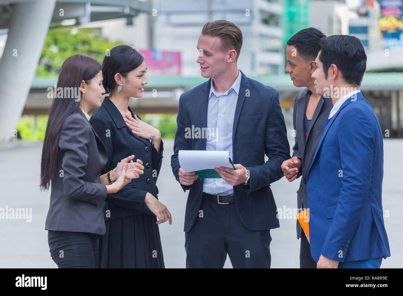 International Business peoples talking outdoor Stock Photo - Alamy