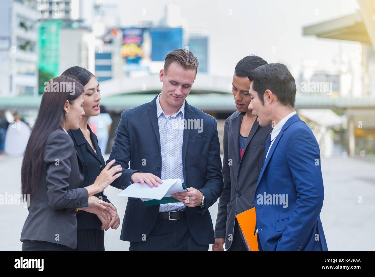business meeting outdoor with team of international peoples Stock Photo ...