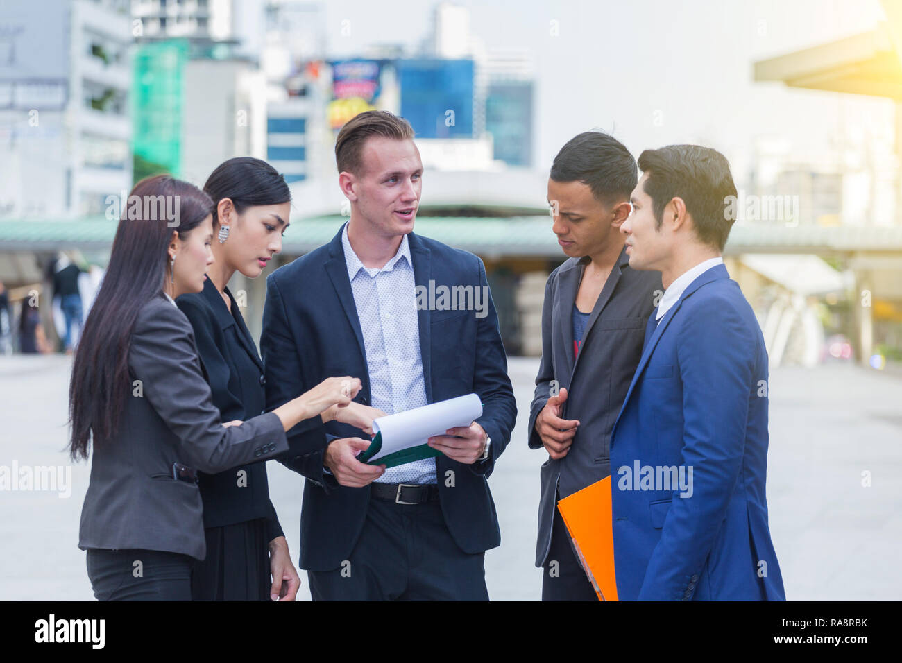 business meeting outdoor with team of international peoples Stock Photo ...