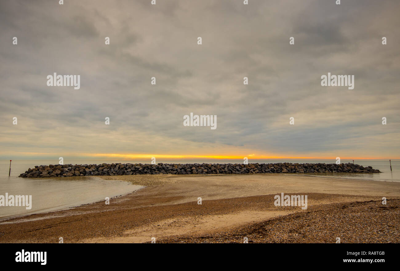 Sea defences and navigation markers at Elmer Sands beach near Middleton ...