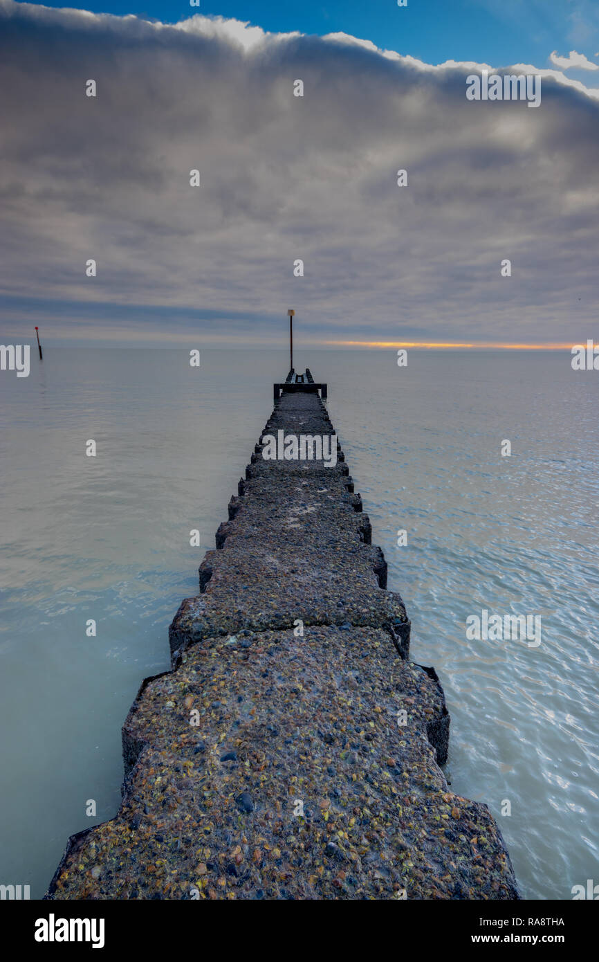 Sea defences and navigation markers at Elmer Sands beach near Middleton ...