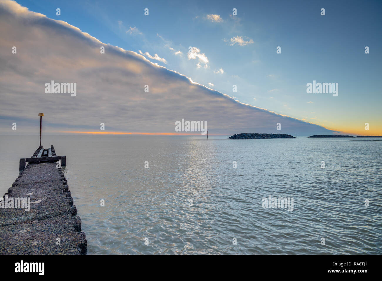 Sea defences and navigation markers at Elmer Sands beach near Middleton ...