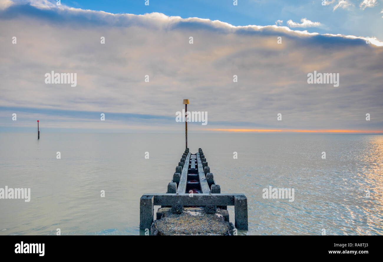 Sea defences and navigation markers at Elmer Sands beach near Middleton ...