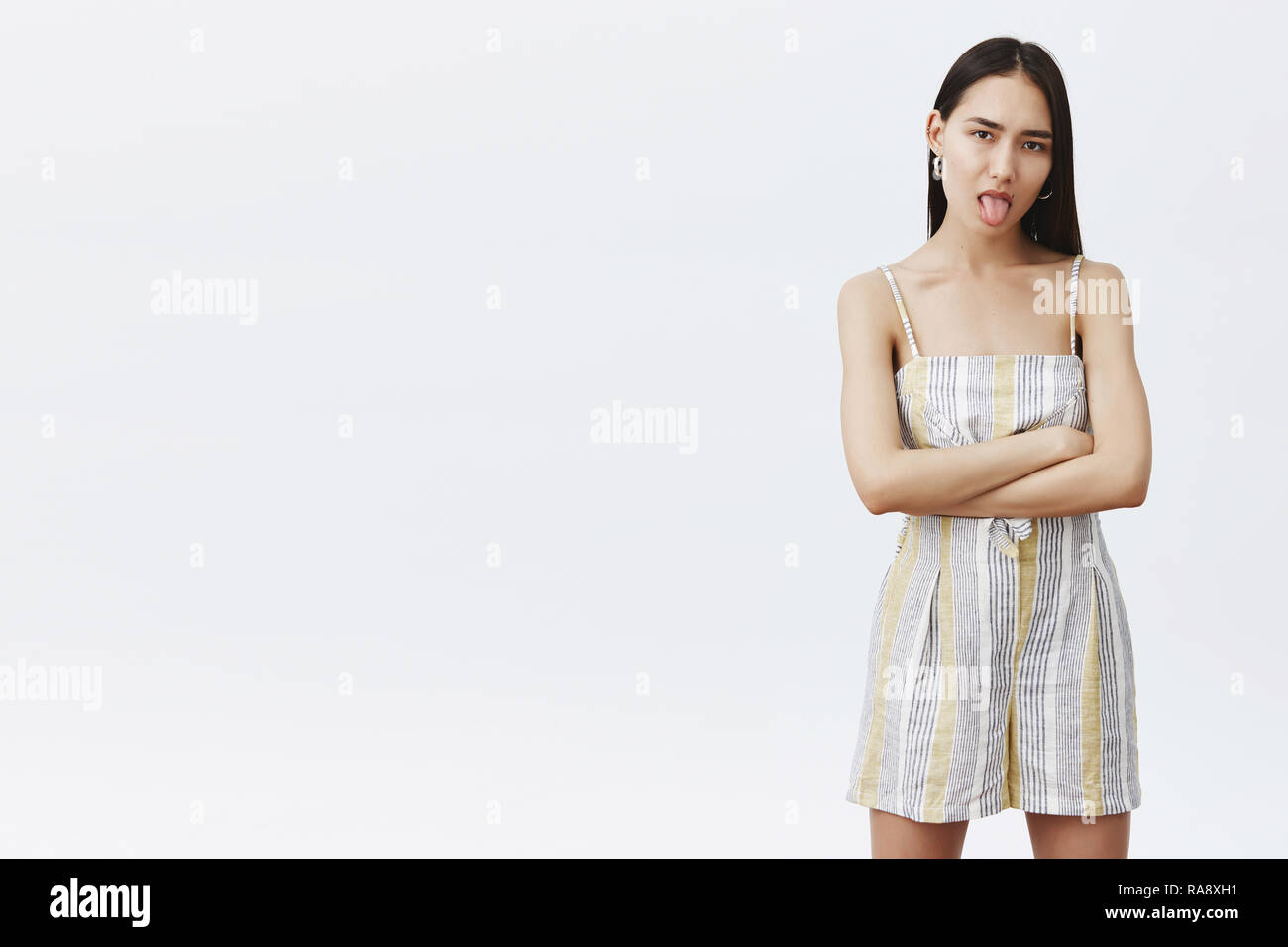 Indoor shot of moody good-looking fashionable woman in matching outfit ...