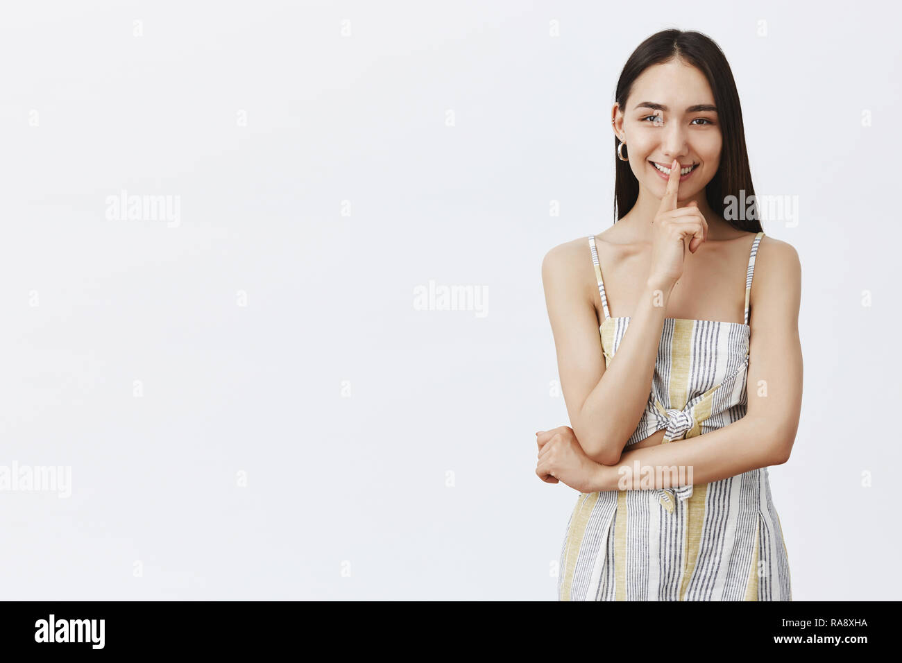 Finger over lip hi-res stock photography and images - Alamy