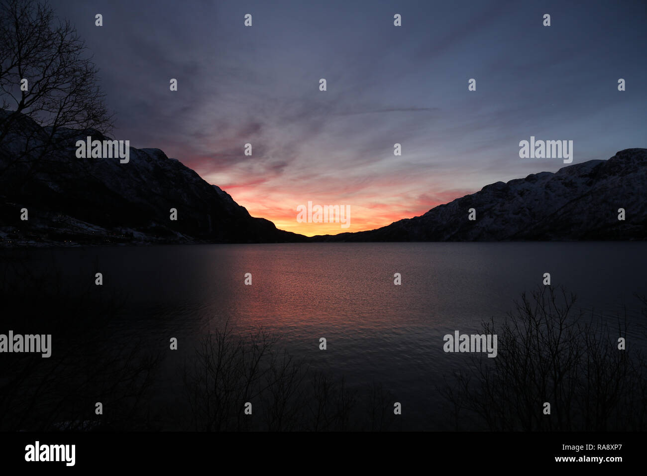 Stunning sunrise over lake and mountains Stock Photo - Alamy
