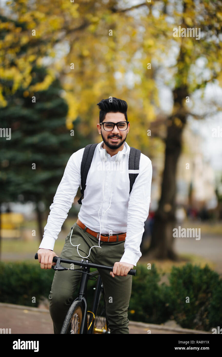 Indian man riding bicycle hi-res stock photography and images - Alamy