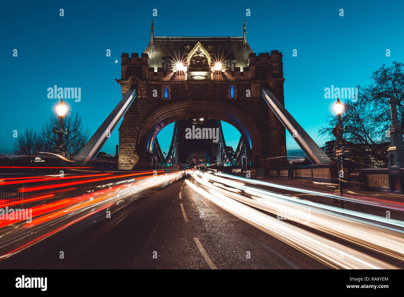 Traffic light trails on Tower Bridge on London city skyline at night ...