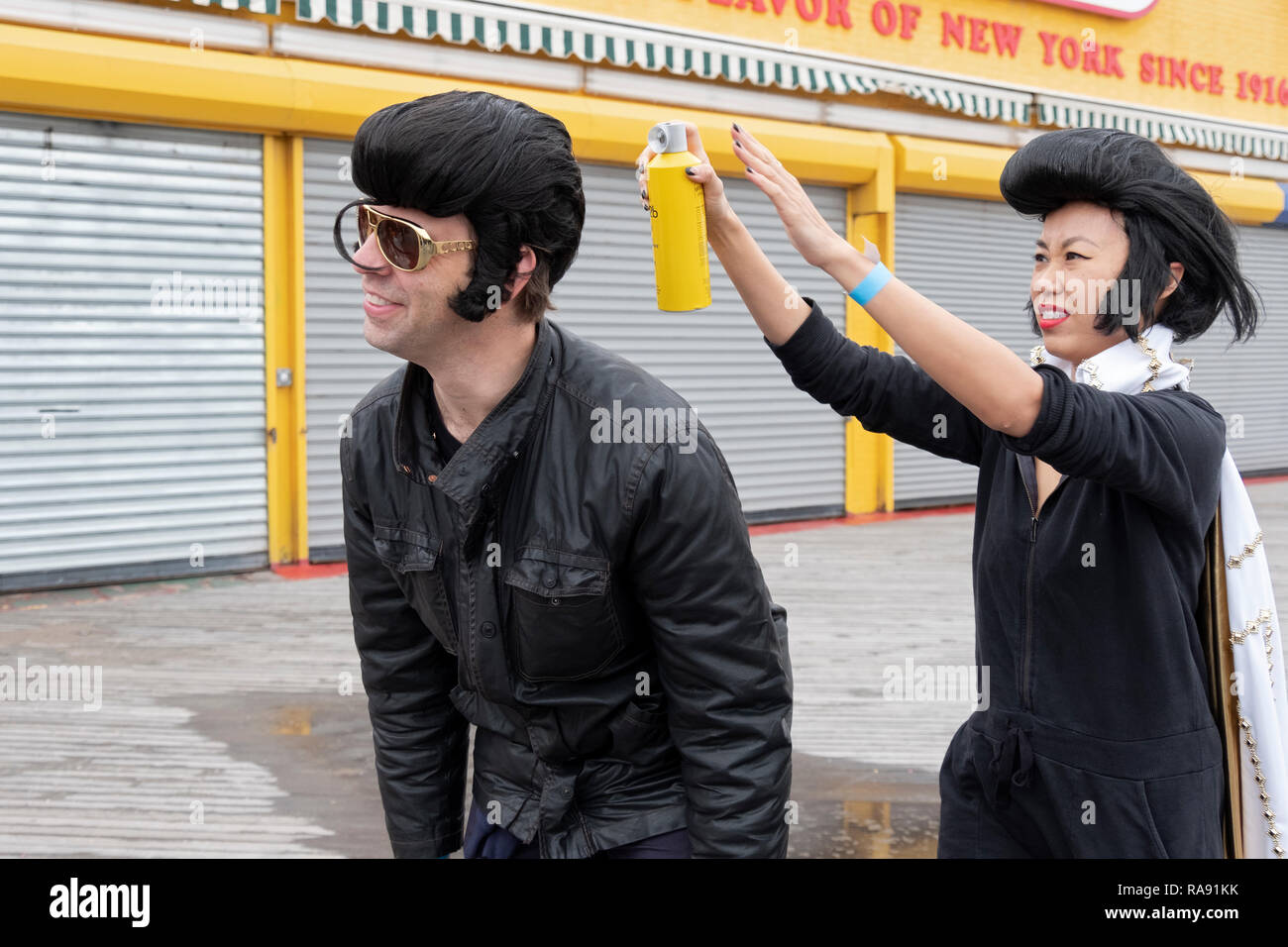 A Chinese Elvis impersonator uses hairs[pray on a Lebanese impersonator ...