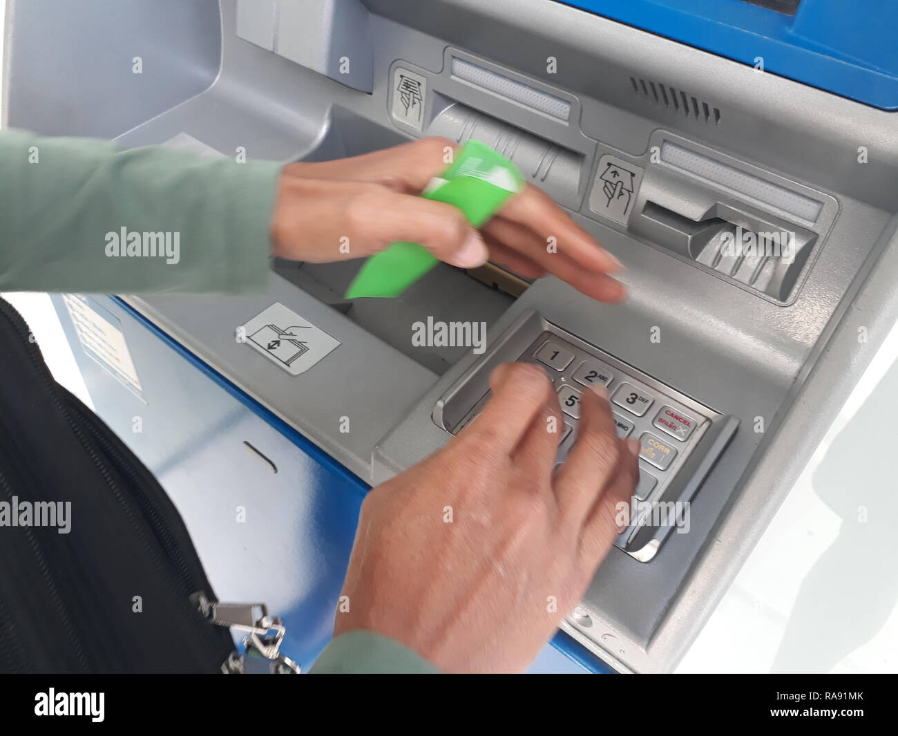 press withdrawal code from atms Stock Photo - Alamy