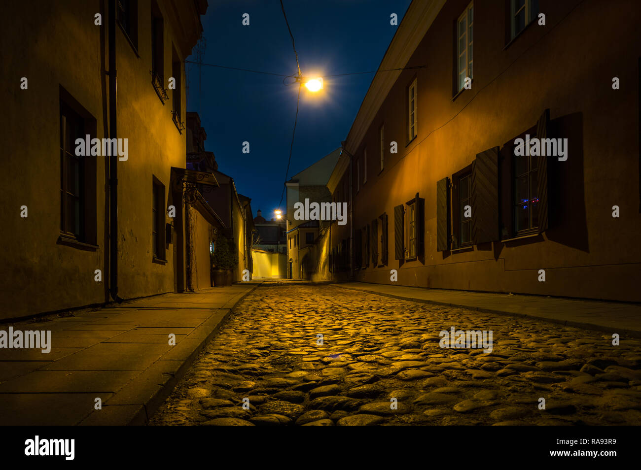 Street at night in Vilnius old town Stock Photo - Alamy