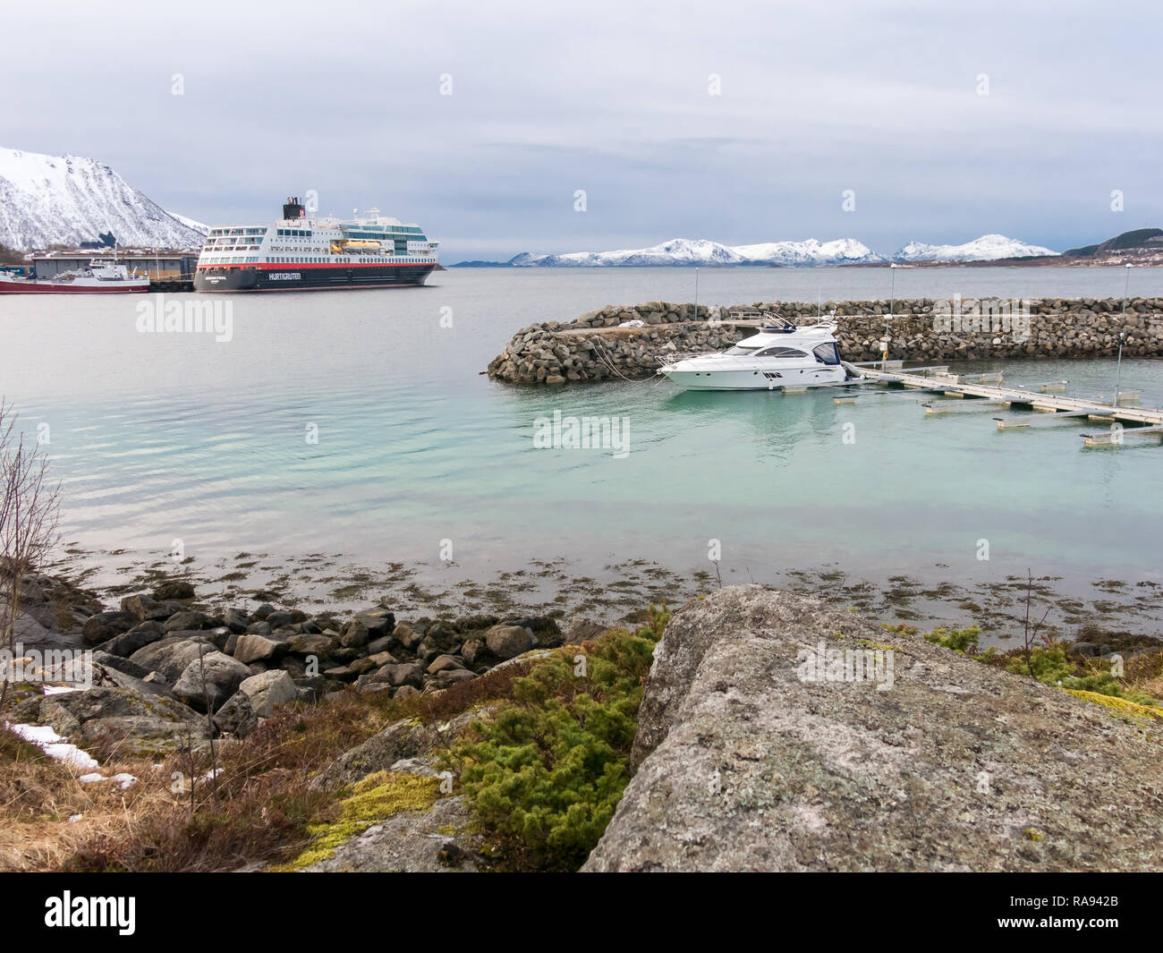 Motor yacht and Hurtigruten cruise ship in Stokmarknes, Hadseloya ...