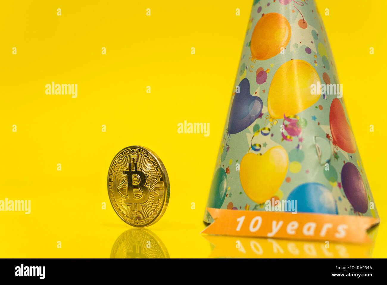 Bitcoin celebrating birthday - 10 years, coin with birthday hat behind ...