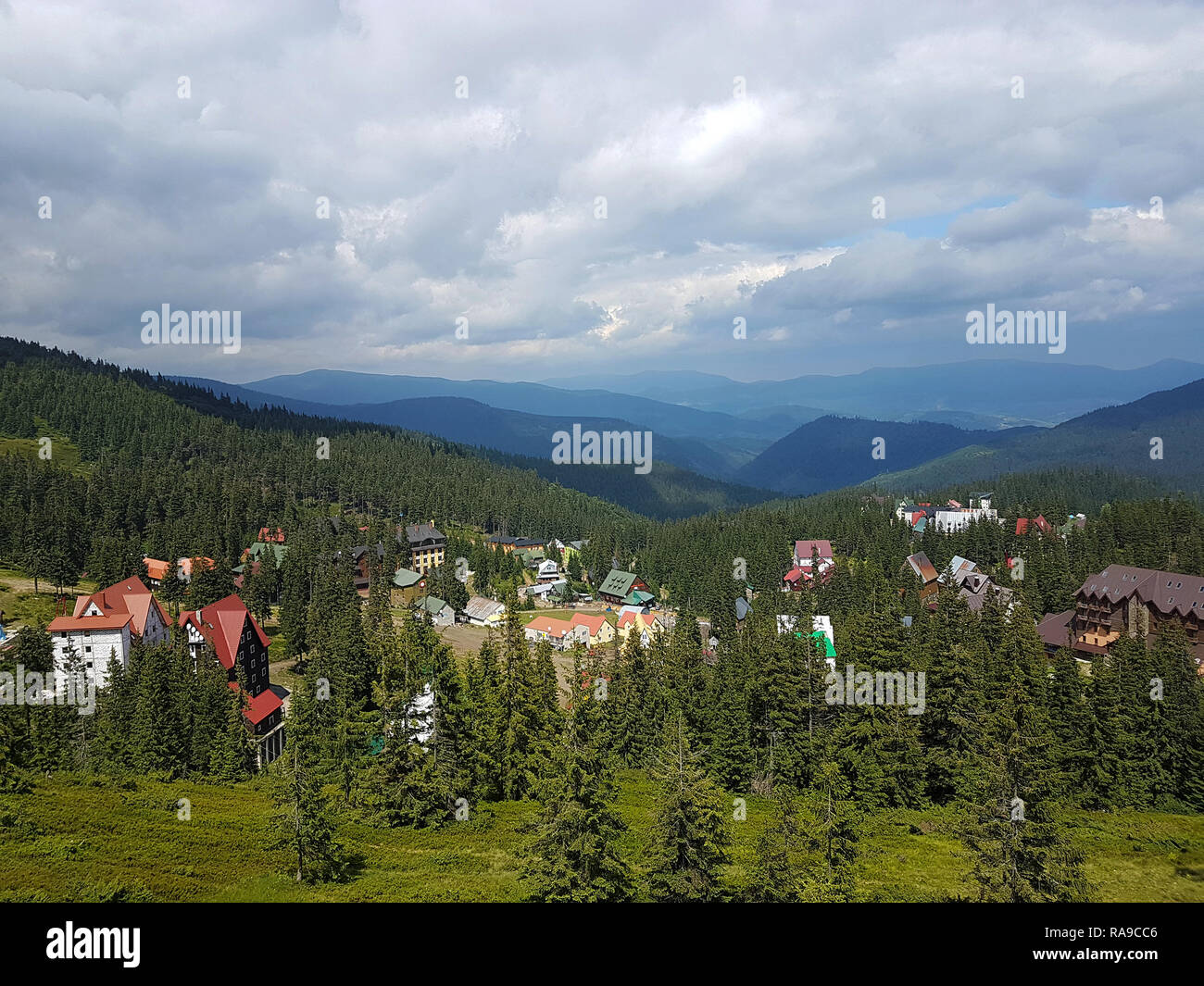 Mountain village landscape with dramatic sky Stock Photo - Alamy