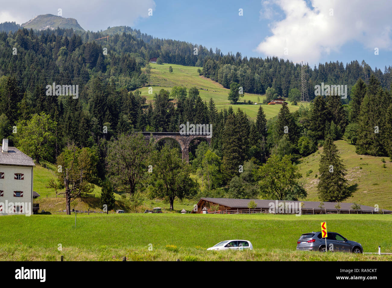 A picturesque Alpine landscape with an old railway bridge. Austria ...