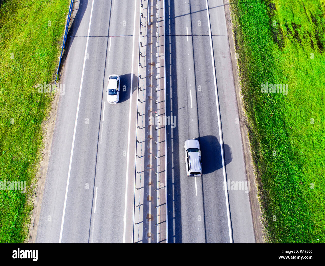 Aerial view of highway in city. Cars crossing interchange overpass ...