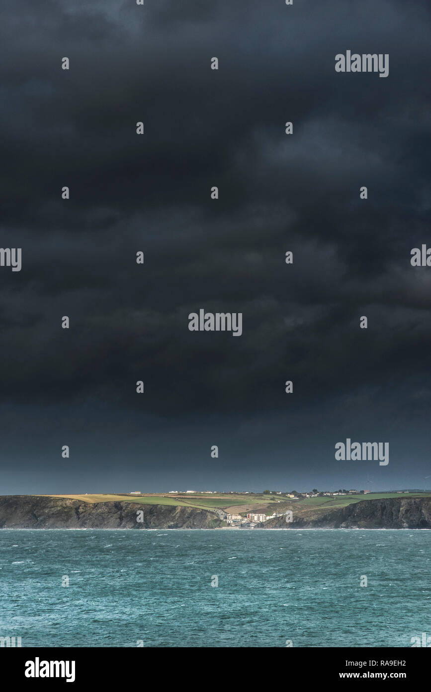 Dark stormy brooding sky with sunlight shining on Watergate on the ...