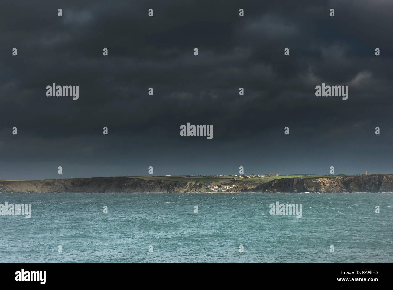 Dark stormy brooding sky with sunlight shining on Watergate on the ...