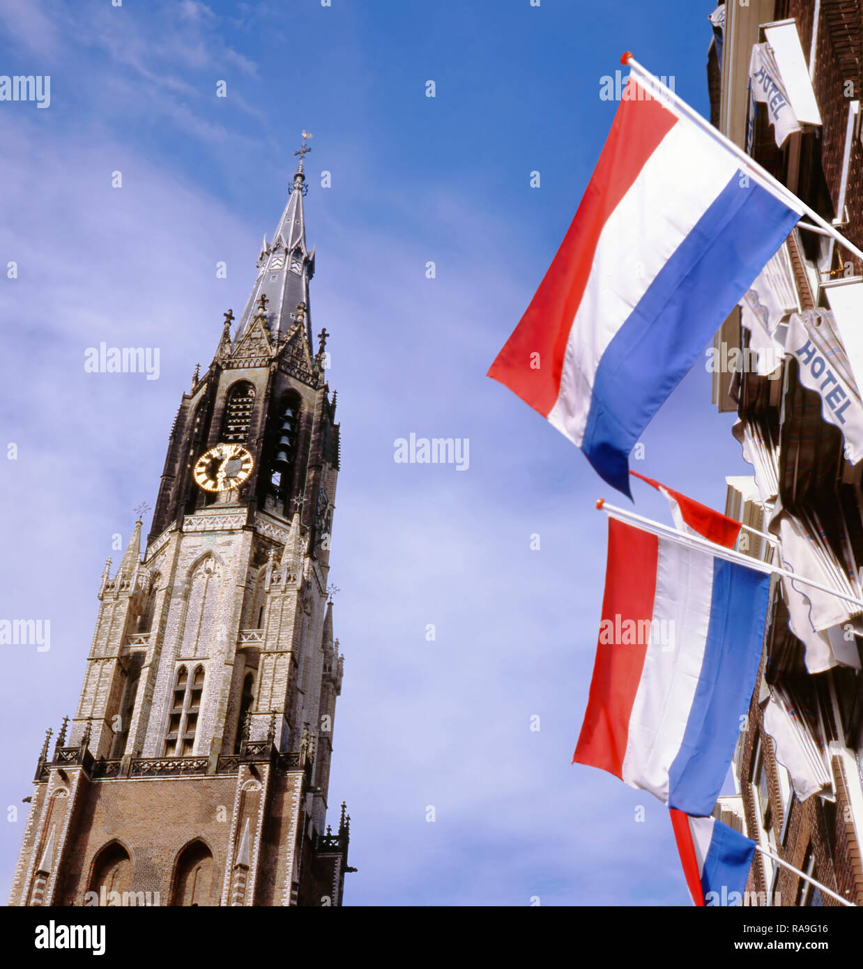 New church and flags at the market place in Delft, Holland.In this ...