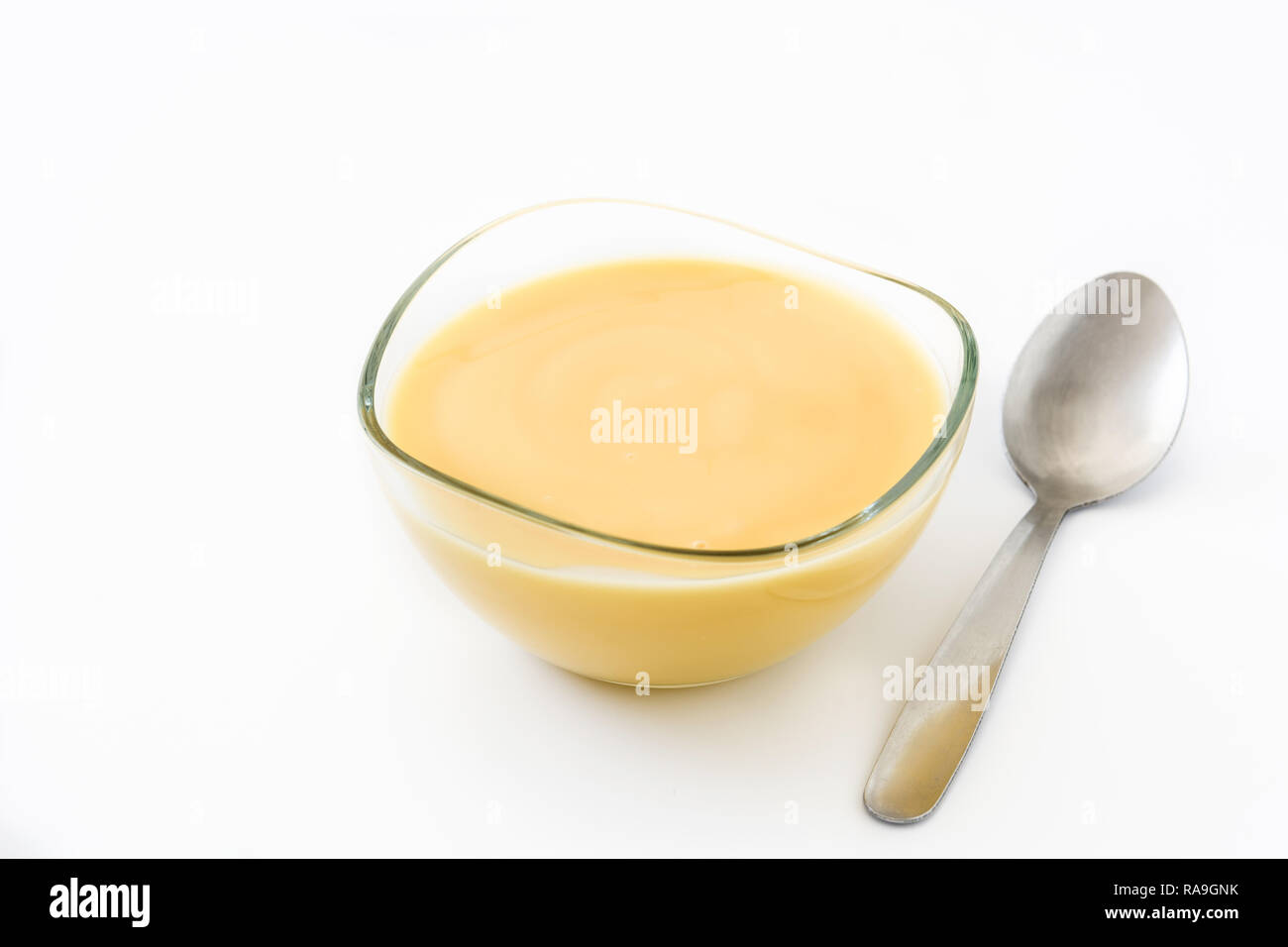 Bowl of homemade vanilla custard isolated on white background Stock ...