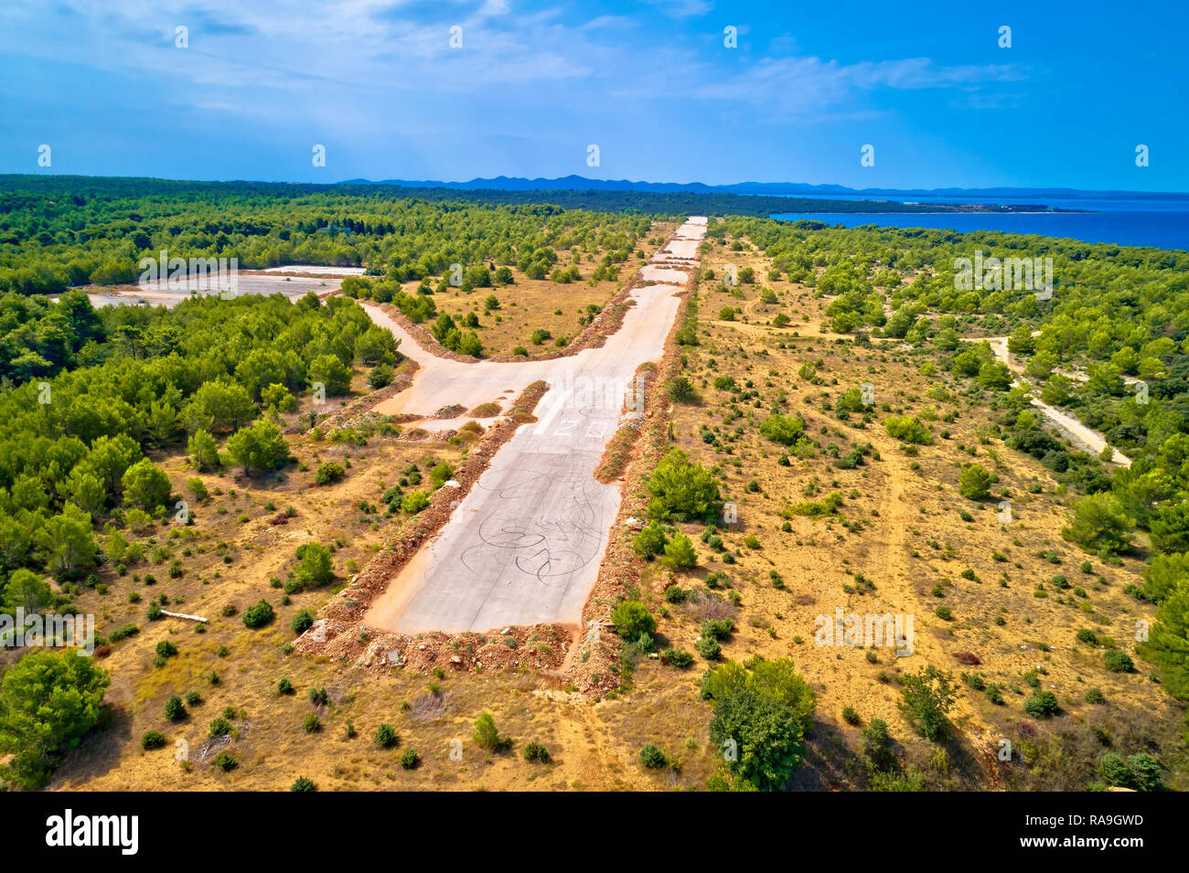 Abandoned and destroyed airport runway in Zadar Sepurine aerial view ...