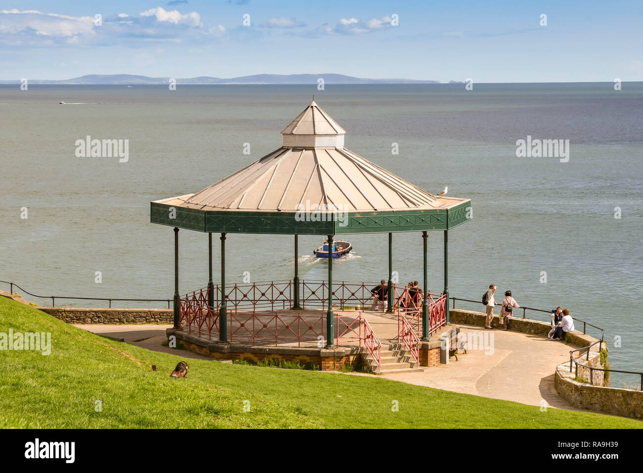 TENBY, PEMBROKESHIRE, WALES - AUGUST 2018: Bandstand and people on the ...