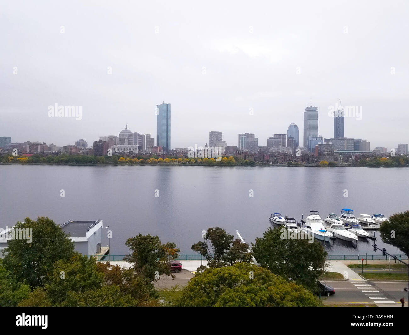 Boston Skyline Across the Charles River. On a rainy day. Boats on the ...