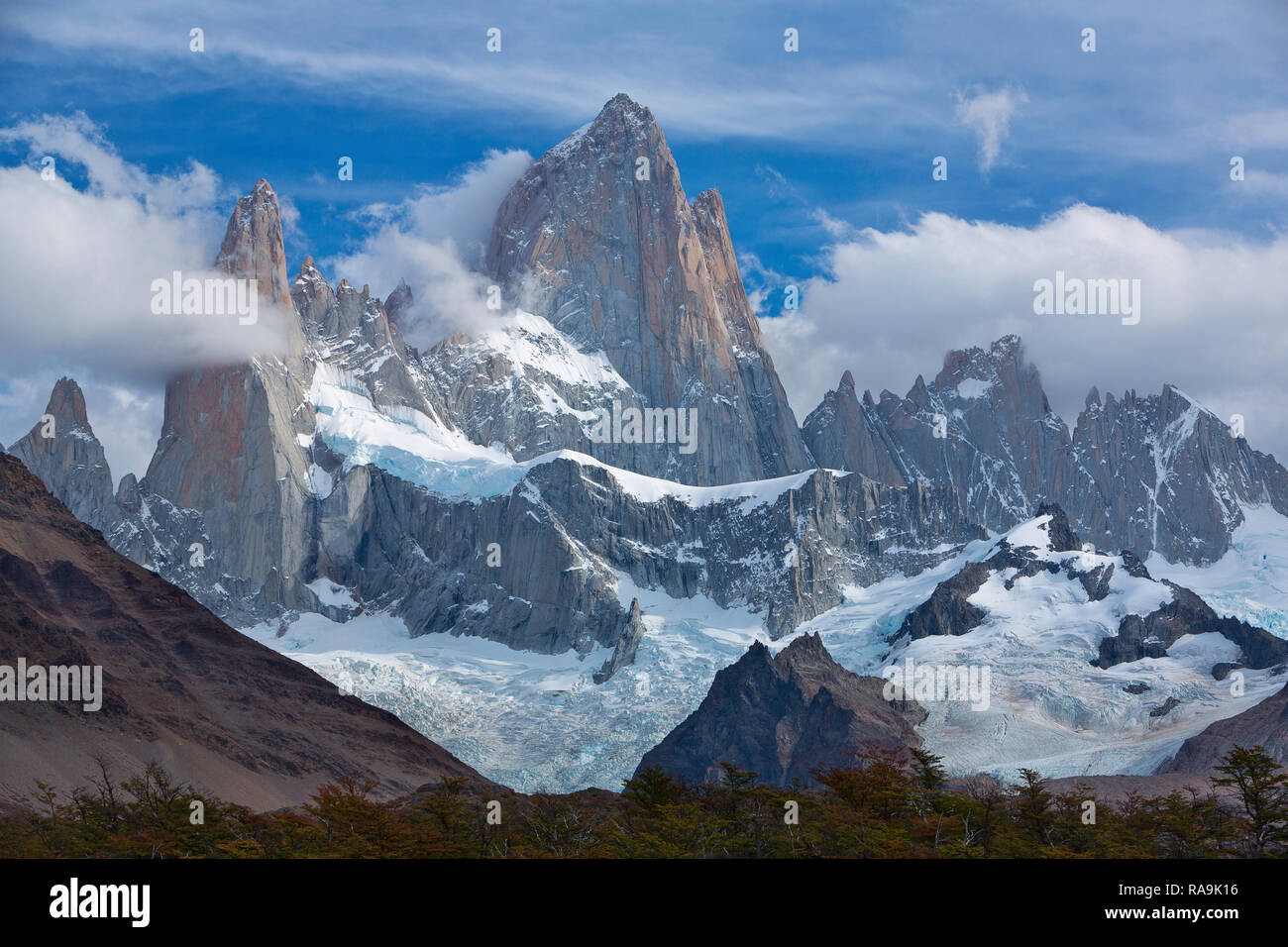 Mount Fitz Roy rises above the fall color below in Argentina Stock Photo - Alamy
