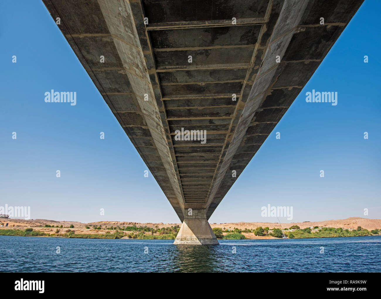 Large cable stayed road bridge spanning a wide Nile river on a clear ...