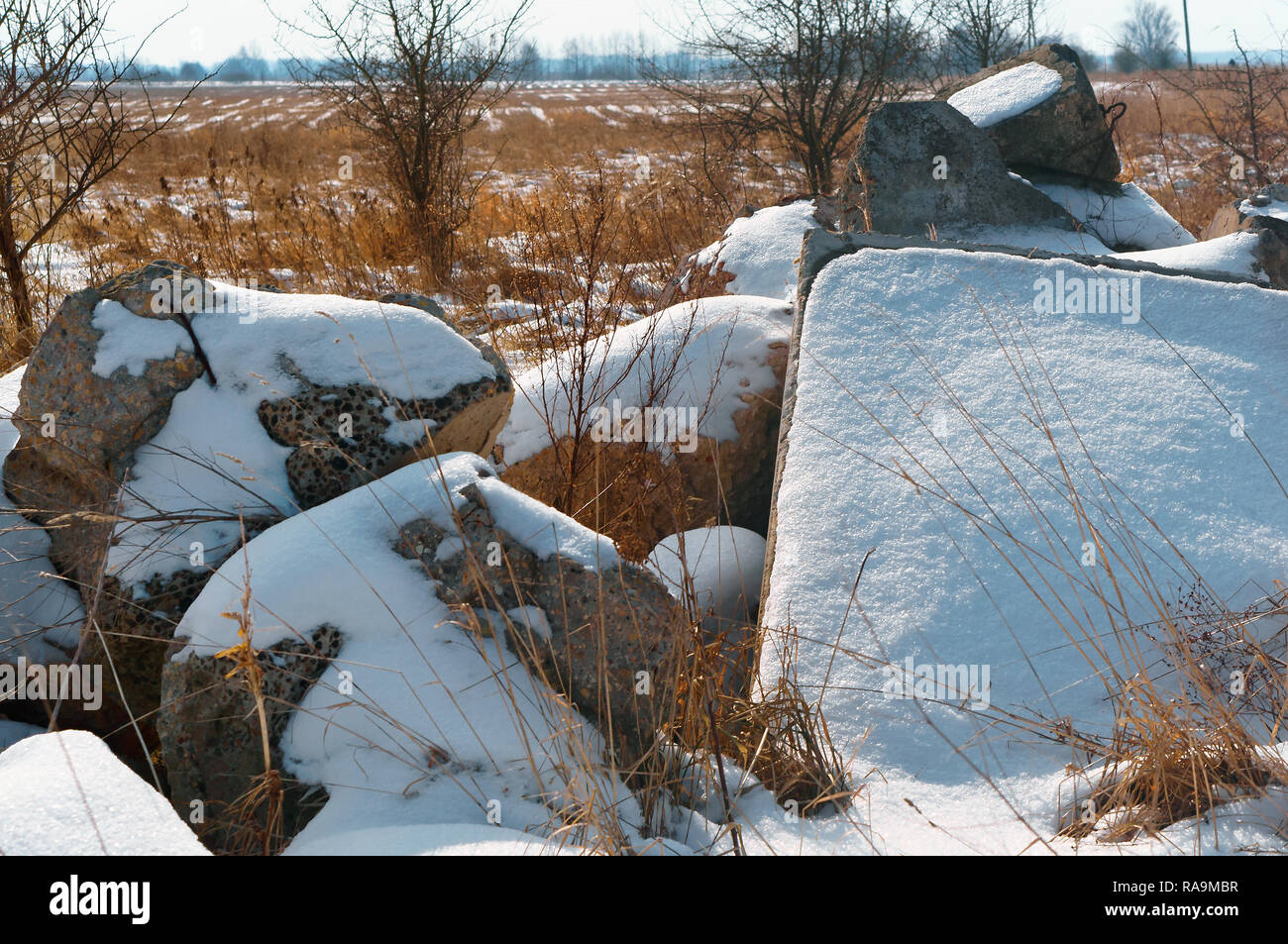 construction waste in the field, concrete slabs pollute the nature ...