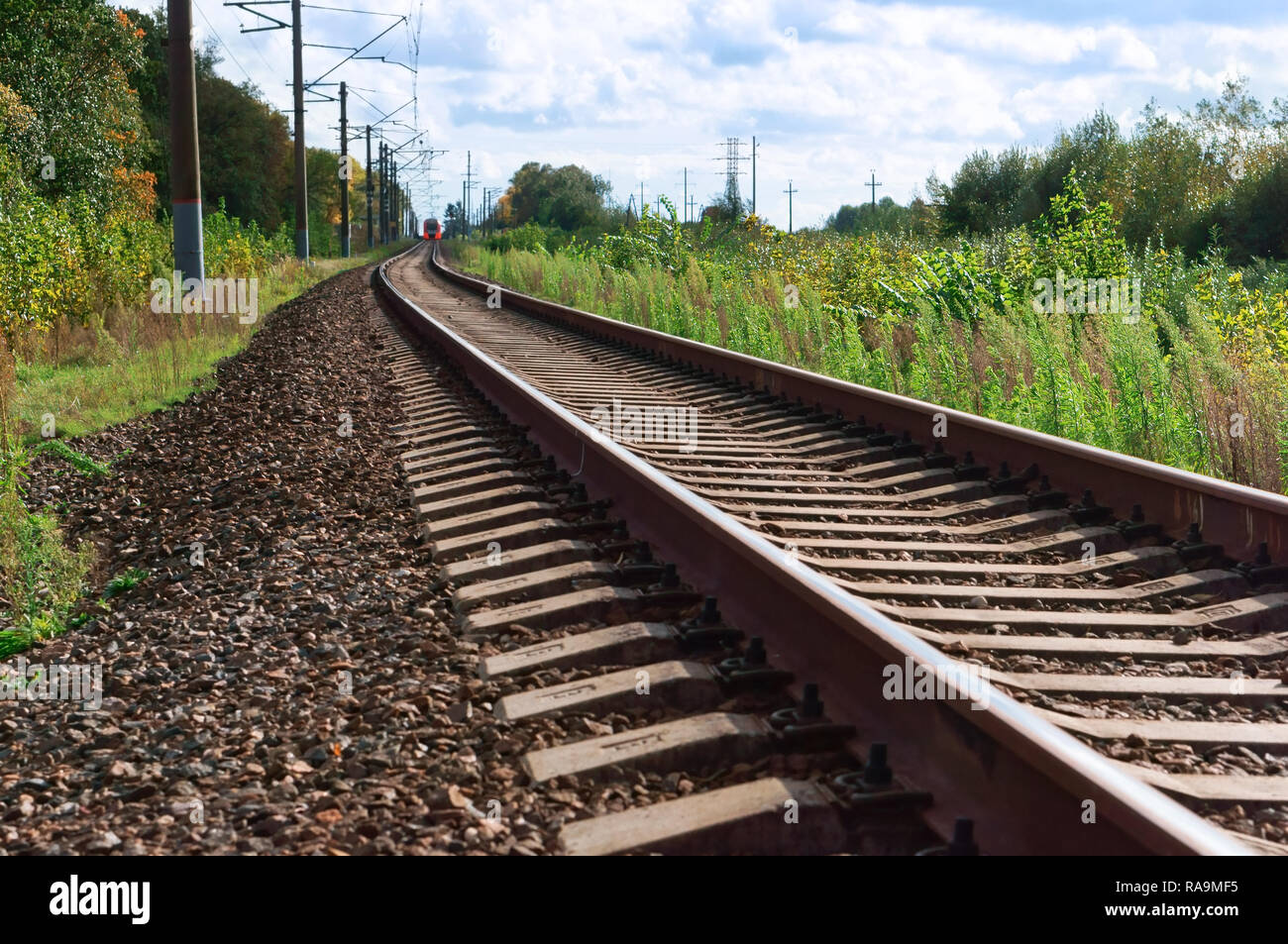 rails stretching into the distance, railroad tracks, turn at the railroad Stock Photo - Alamy