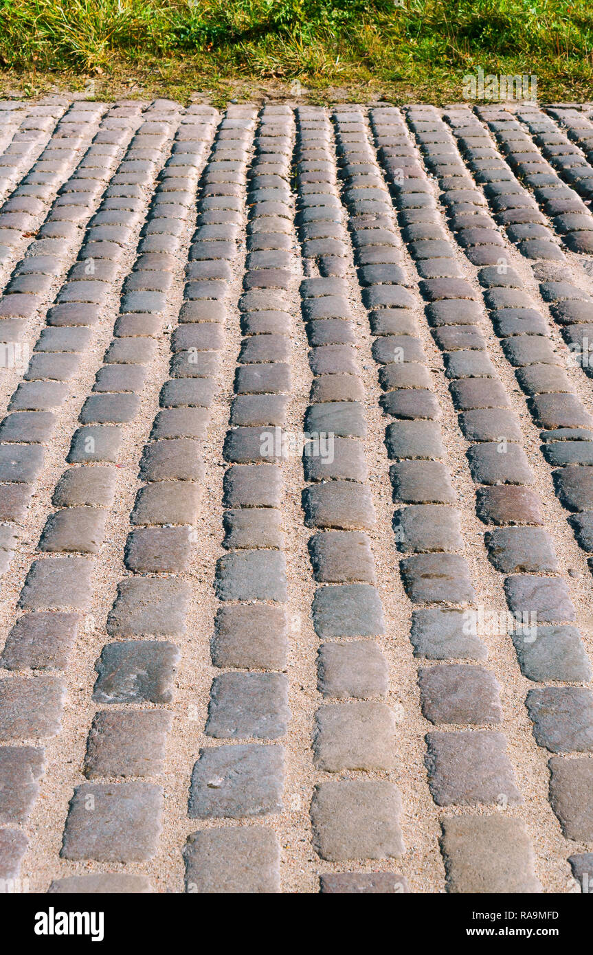 a smooth paving stone, road paving stones, cobblestones Stock Photo - Alamy