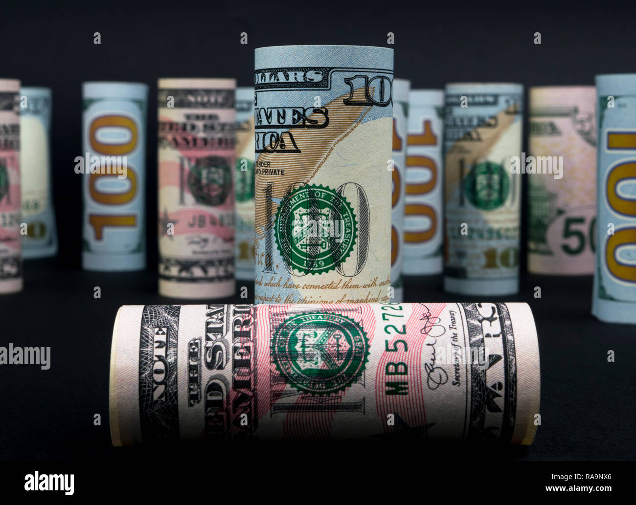 Dollar. Dollar banknotes roll in other positions. American US currency ...
