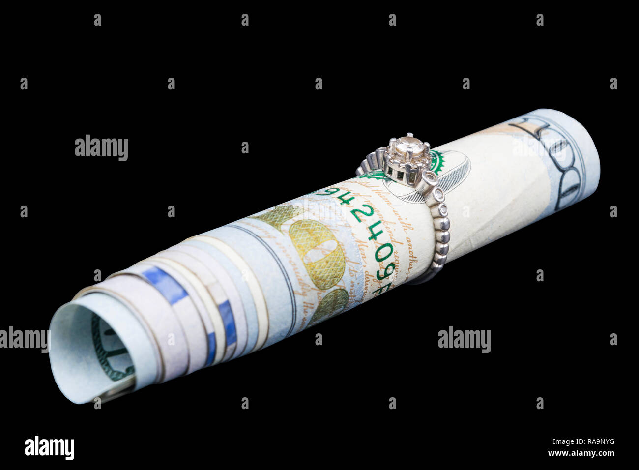 Beautiful jewelry. Brilliant wedding ring on dollar bill. Prenuptial ...