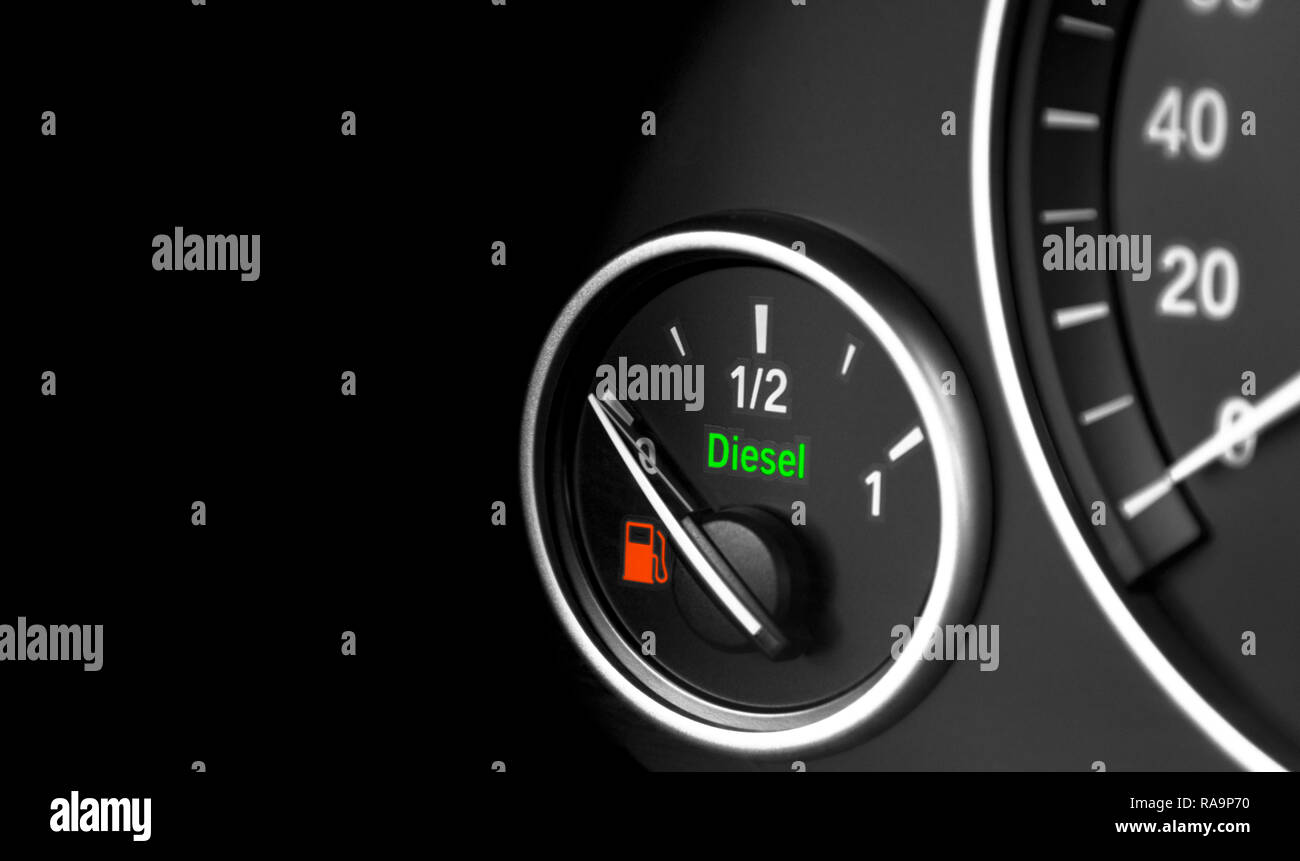 close up of a modern car interior dashboard details. Fuel level. Diesel ...