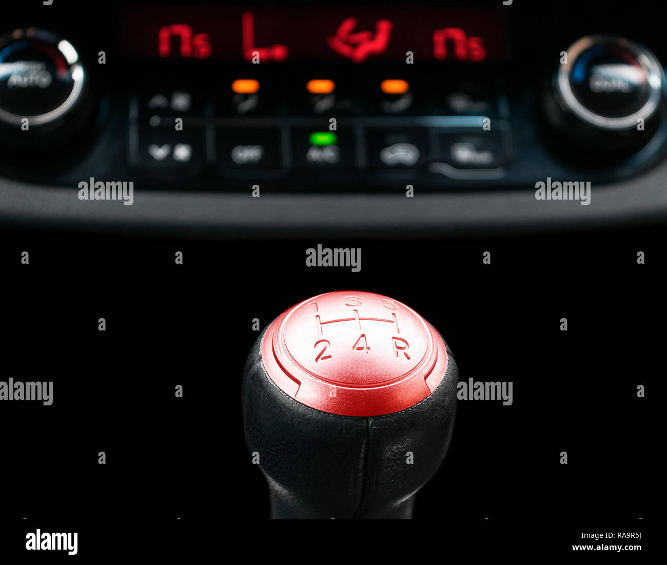 Close up view of a red gear lever shift, manual gearbox, car interior ...