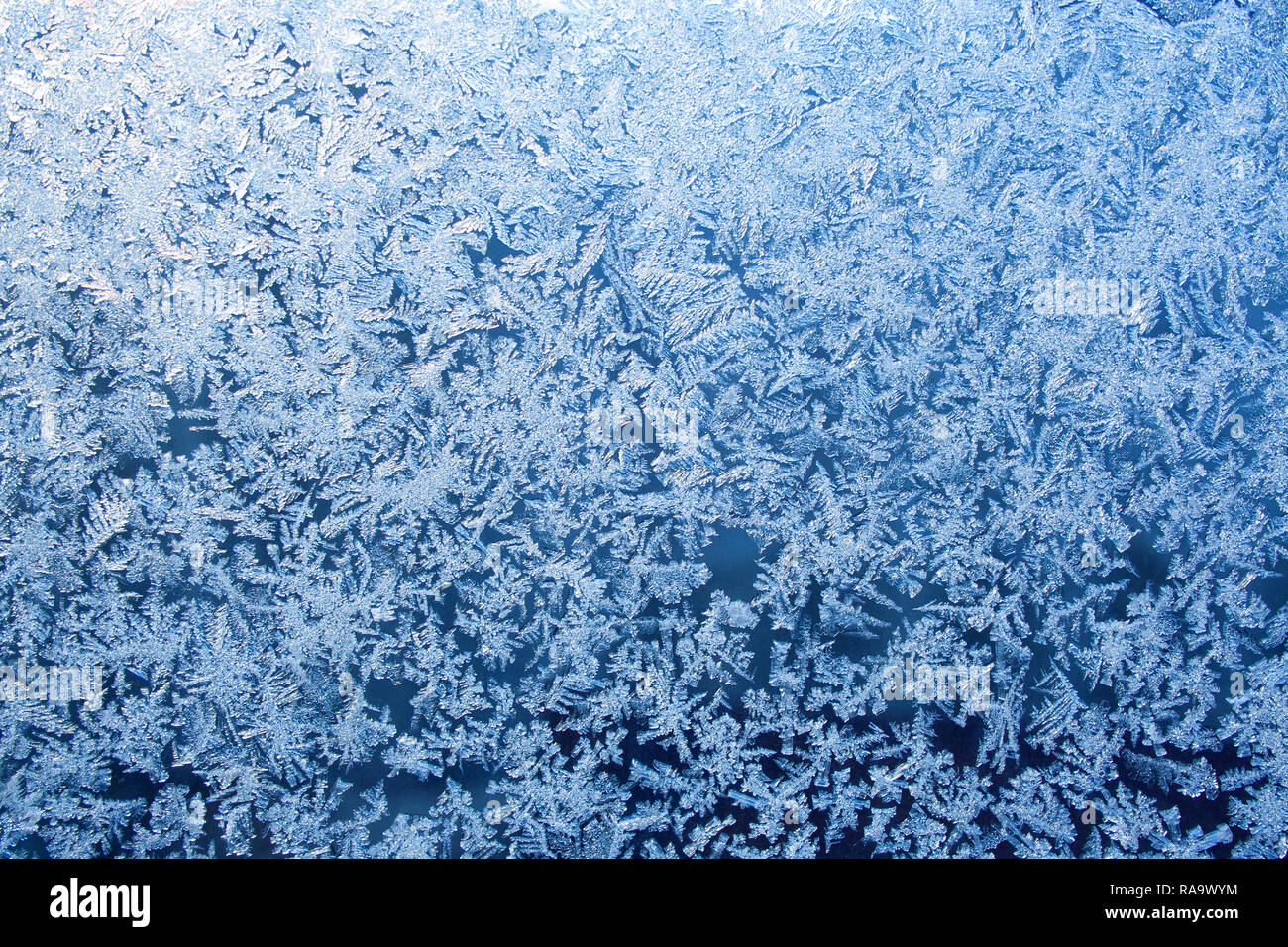 Ice crystals pattern on the window close up. Ice texture. Winter ...