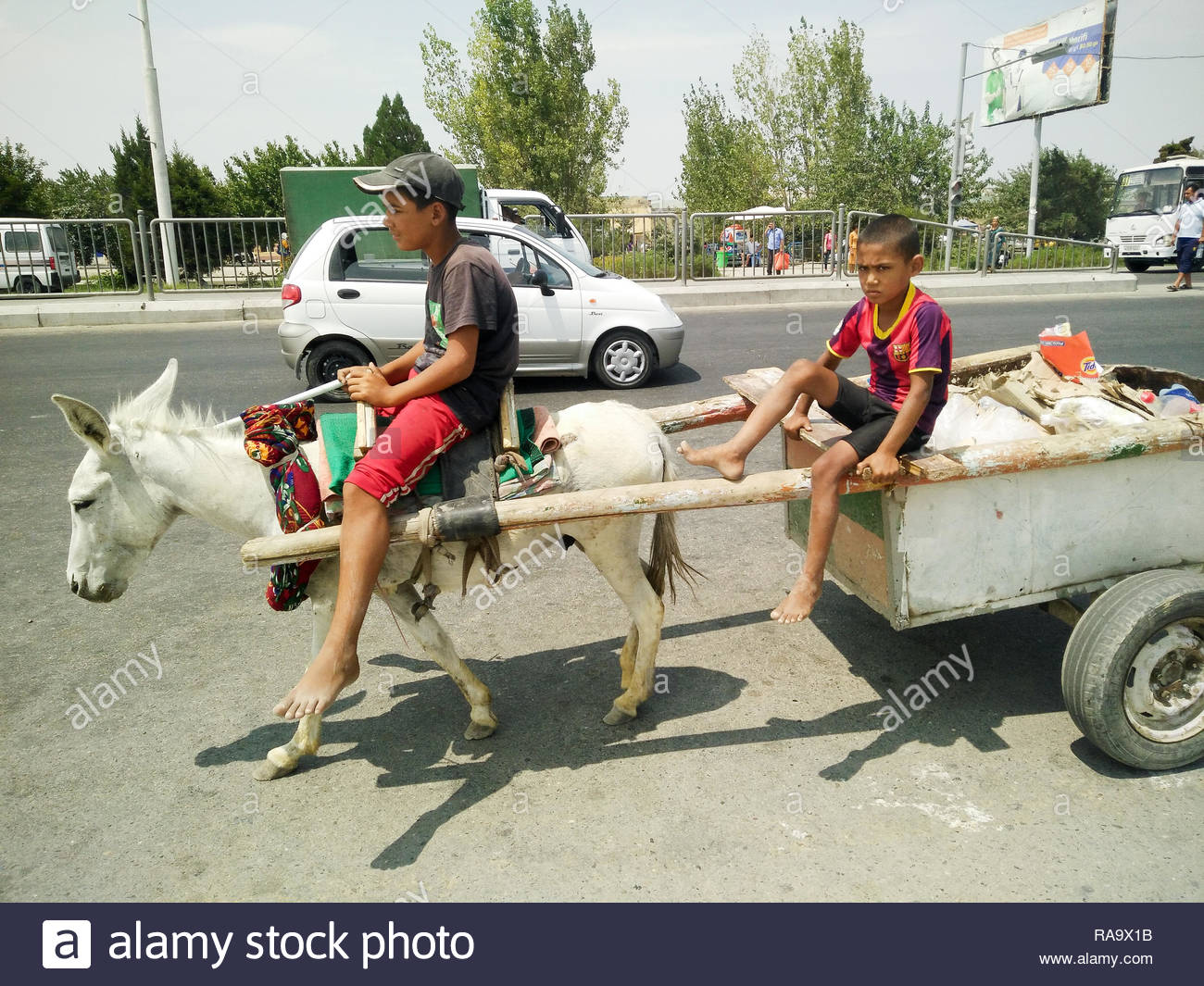 Children Riding A Donkey Stock Photos & Children Riding A Donkey Stock ...